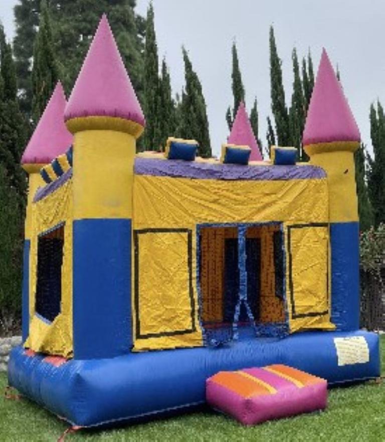 PINK AND YELLOW CASTLE BOUNCE HOUSE